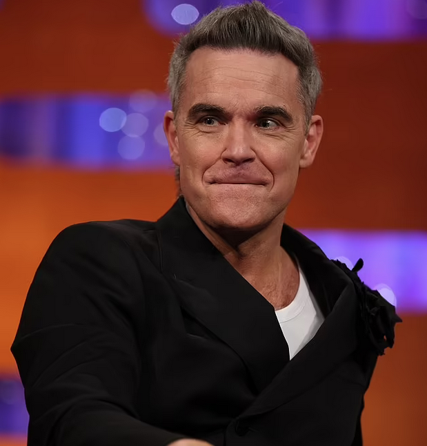 Robbie Williams, 50, reveals plans to resit his GCSEs after a lifetime ...